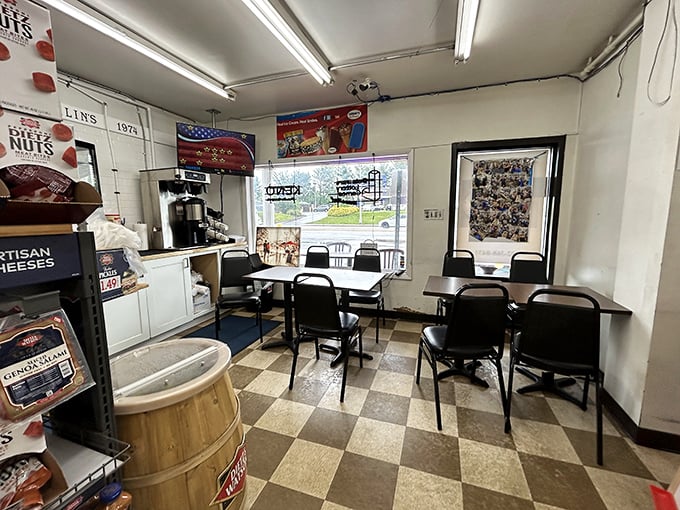 Inside, the checkerboard floor and no-nonsense seating tell you everything: this place prioritizes sandwich craftsmanship over interior design trends.