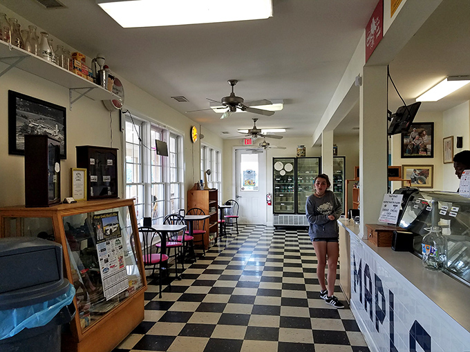Step inside to a classic black-and-white checkered floor that feels like walking into an ice cream parlor from your fondest childhood memories.