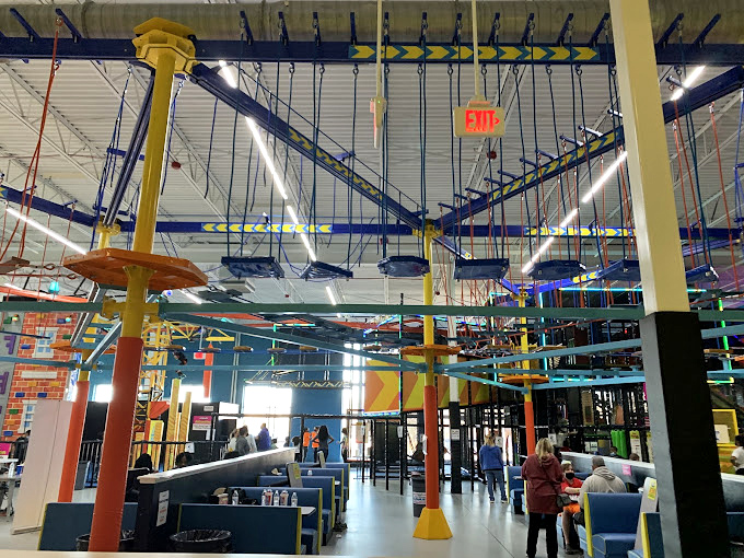 Little speed demons start young! This mini-motorcyclist is getting his first taste of arcade thrills before he's even tall enough for a real license. 