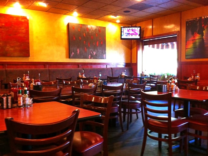 Warm yellow walls, rich wood furnishings, and colorful art create that perfect morning sanctuary where coffee flows and breakfast dreams come true.