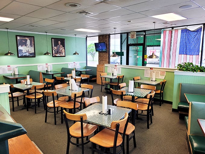 Mint green walls, wooden chairs, and checkered tablecloths &ndash; this isn't interior design, it's time travel to when comfort mattered more than Instagram.