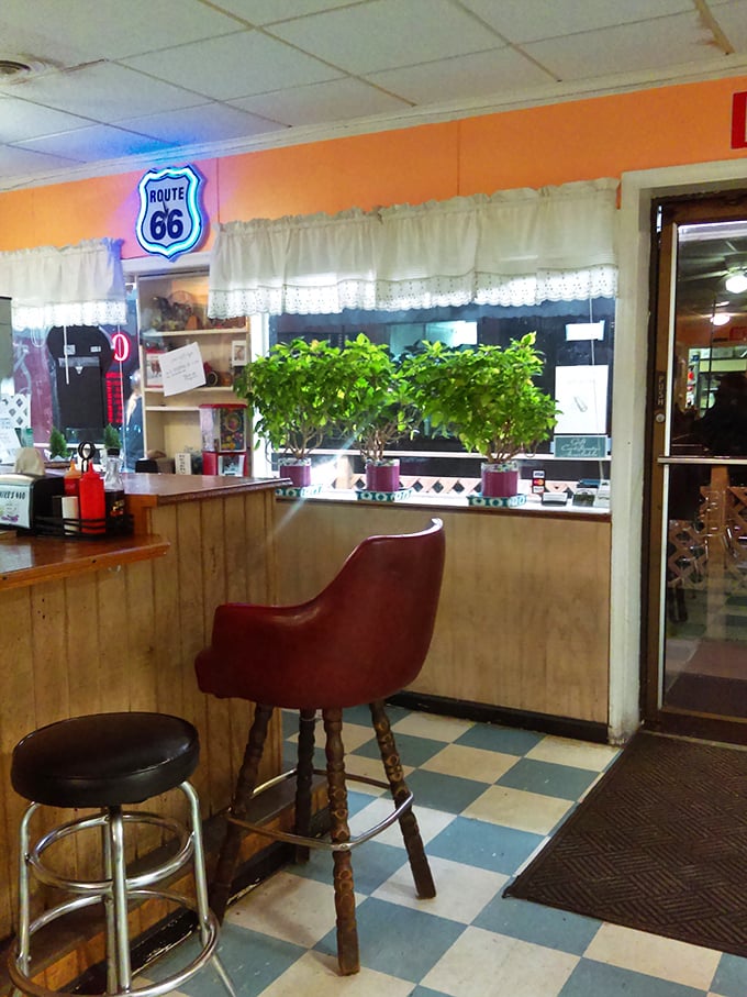 Classic Americana lives in this checkered-floor sanctuary where the Route 66 sign promises a journey for your taste buds.