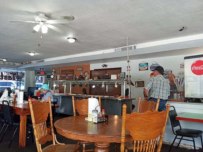 Step inside and feel the nostalgia wash over you. Every inch of wall space tells a story, while the wood paneling whispers, "You're home now."