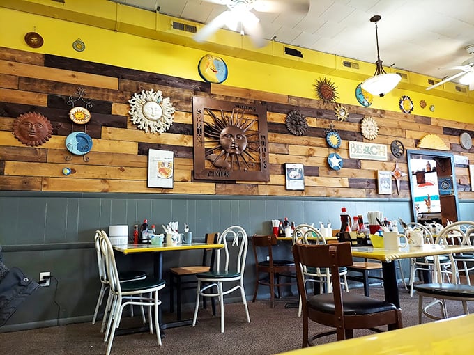 The interior's sunny yellow walls and eclectic sun-themed d&eacute;cor create the perfect backdrop for morning conversations and coffee refills.