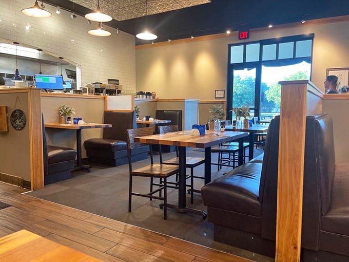Cozy booths and warm wood tones create the perfect backdrop for morning conversations. The thoughtful interior design strikes that elusive balance between trendy and comfortable.