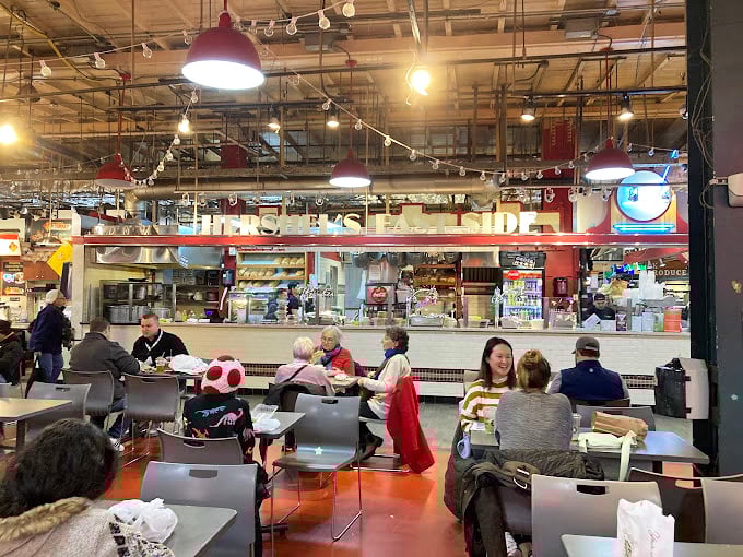 The industrial-chic ceiling gives way to the real stars: diners savoring every bite. This isn't just eating&mdash;it's a communal celebration of culinary tradition.