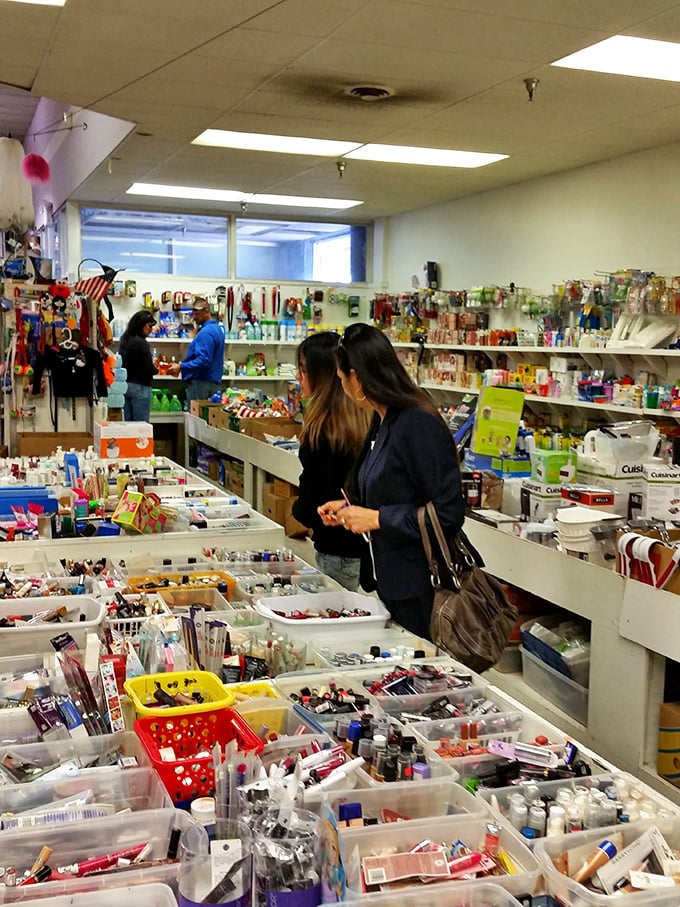Treasure hunters scan meticulously organized bins of small items. The archaeological dig of modern commerce happens one plastic container at a time.