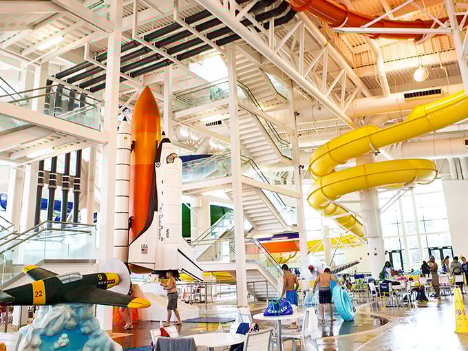 Imagine NASA engineers and water park designers had a brainstorming session. The result? This dazzling interior where rocket ships and water slides coexist in chlorinated harmony.