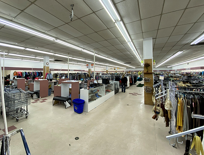 Endless racks stretch toward retail infinity. In this fluorescent-lit galaxy of secondhand goods, time becomes merely a suggestion.