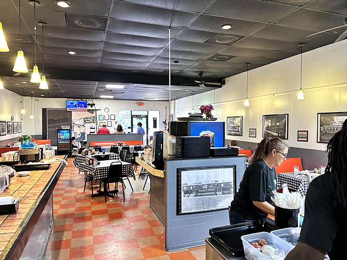 Classic diner ambiance with checkered tablecloths and pendant lighting creates that perfect "come as you are" atmosphere where memories are made between bites. 