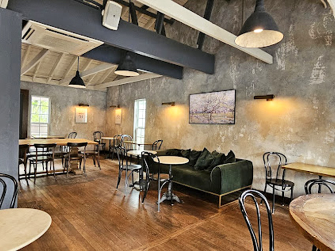 The interior strikes that perfect balance between rustic and refined, with textured walls and wooden beams that make you feel like you've discovered a secret European caf&eacute;. 