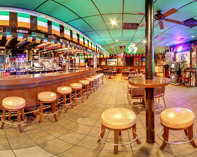 Step inside and suddenly you're in Dublin, not Little Rock. That curved bar isn't just serving drinks—it's telling stories with every perfectly poured pint.