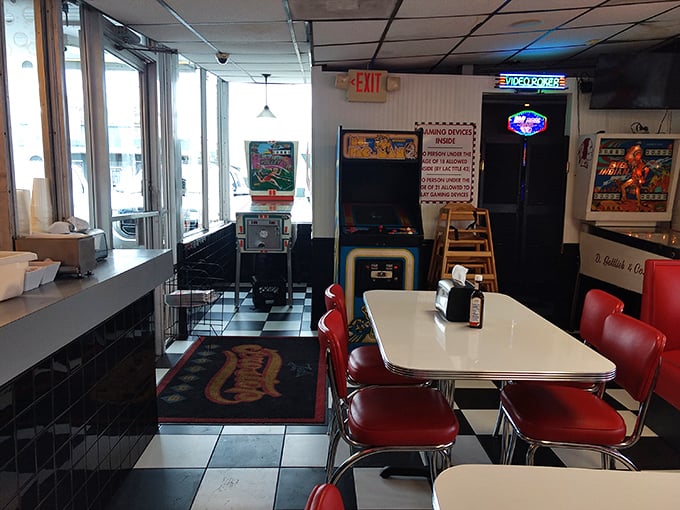 Classic red vinyl booths and checkerboard floors transport you to simpler times when conversations happened face-to-face and phones were attached to walls.