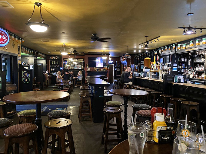 Inside, wooden tables, ambient lighting, and the warm buzz of conversation create that perfect Irish pub atmosphere where strangers become friends over pints.