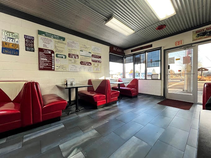 Red vinyl booths and classic diner aesthetics create the perfect backdrop for conversations that matter&mdash;or don't. This isn't Instagram-bait; it's genuine Americana.