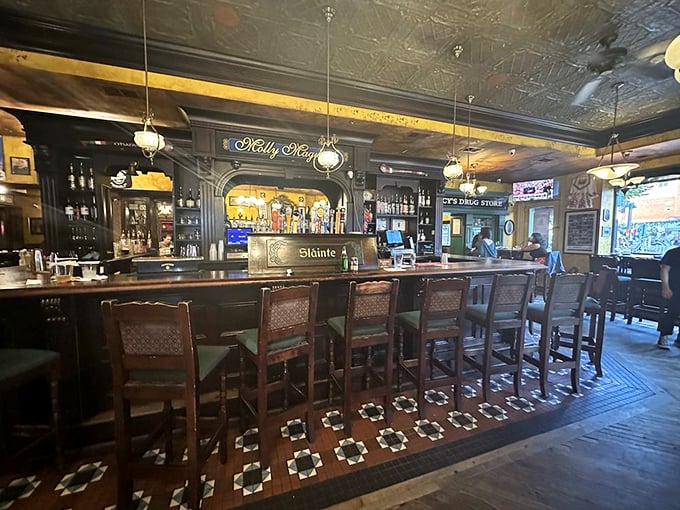 Rich wood, pressed tin ceilings, and pendant lighting create the perfect pub atmosphere &ndash; like a warm hug in architectural form.