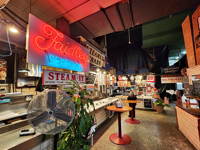 Inside Faidley's, the neon glow illuminates a seafood wonderland where time stands still and crab cake dreams come true.