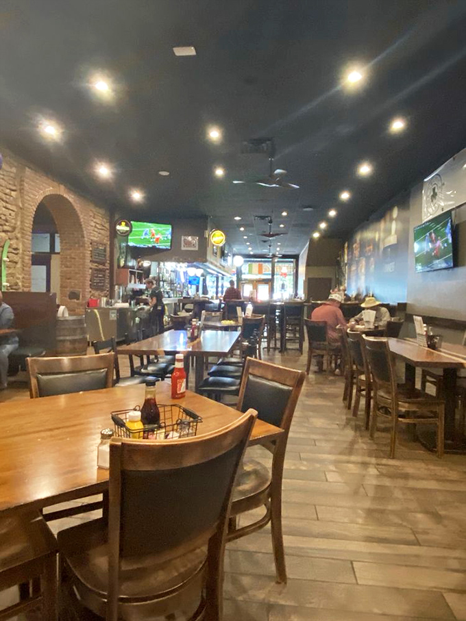 Inside, exposed brick walls and warm wood tones create that perfect pub atmosphere where strangers become friends and friends become family.