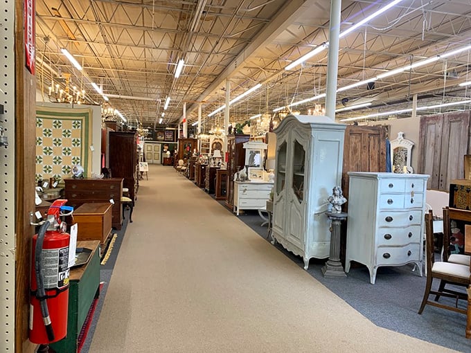 Endless aisles of furniture history stretch before you. Each piece silently whispering stories of dinner parties and family gatherings from decades past.