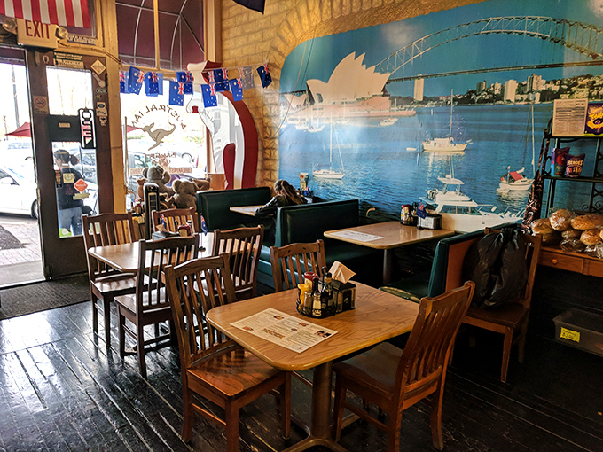 Sydney Harbor meets Southern hospitality in this cozy dining room where Australian flags flutter above wooden tables.