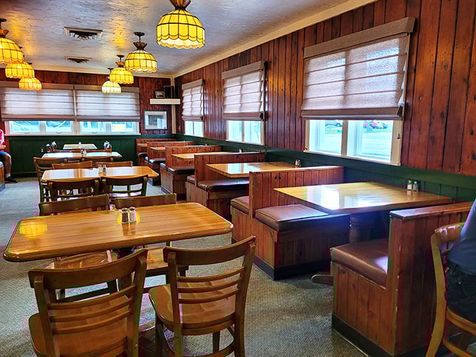 Wood-paneled walls and cozy booths create that perfect small-town ambiance where conversations flow as freely as the coffee.