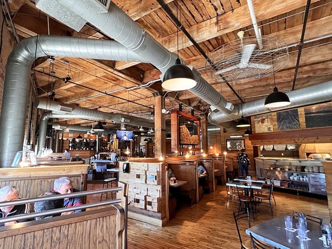 Step inside and the building reveals its soul &ndash; exposed wooden beams, vintage brick, and gleaming ductwork create that perfect "we've-been-here-forever-and-plan-to-stay" vibe.