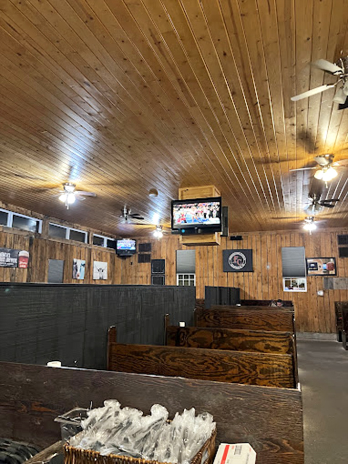 Warm pine paneling and cozy booths create that "come as you are" atmosphere where conversations flow as freely as the sweet tea.