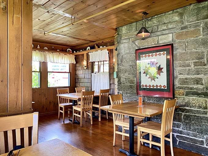 Stone walls meet wooden beams in this cozy dining space, where rustic charm isn't manufactured by a design team but earned through decades of service.