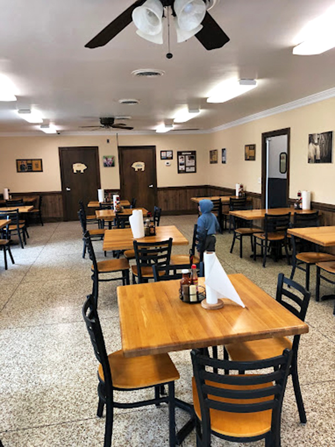 Simple wooden tables, ceiling fans, and pig silhouettes on the doors&mdash;this is barbecue's sacred space where conversations flow as freely as sweet tea.
