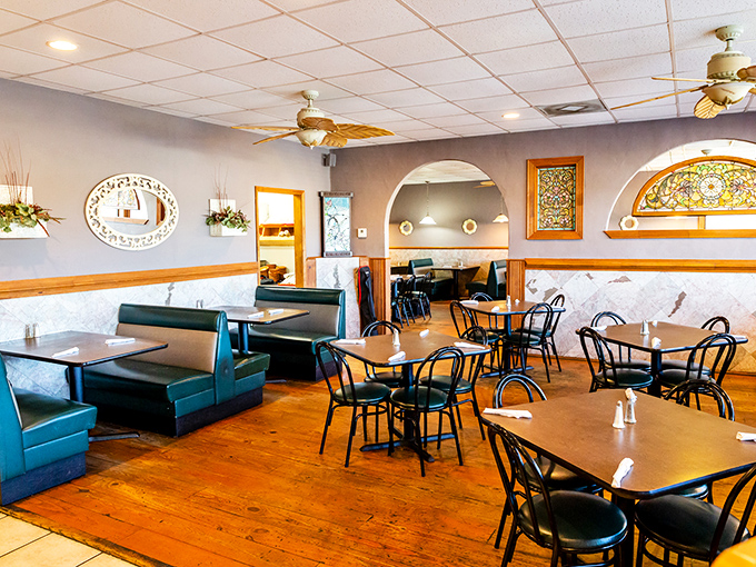 The dining room at Jimmy's combines comfort with subtle elegance—those stained glass accents are like jewelry on a well-dressed Southern belle.