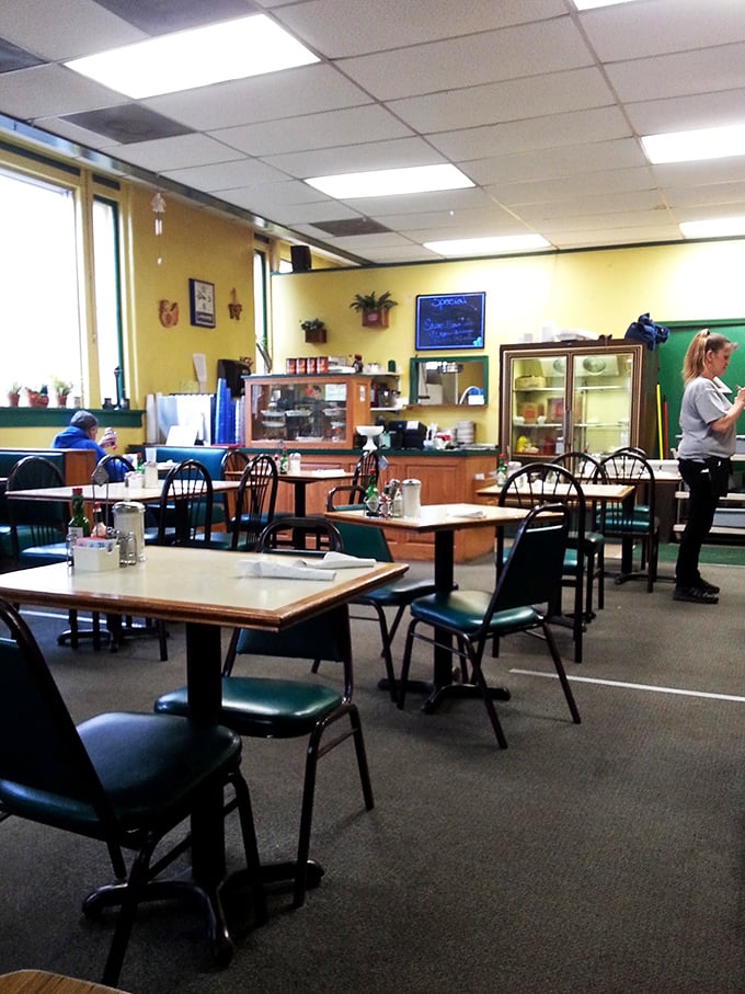 Inside, sunny yellow walls create a cheerful backdrop for no-nonsense tables where strangers become friends over coffee and the promise of pie.