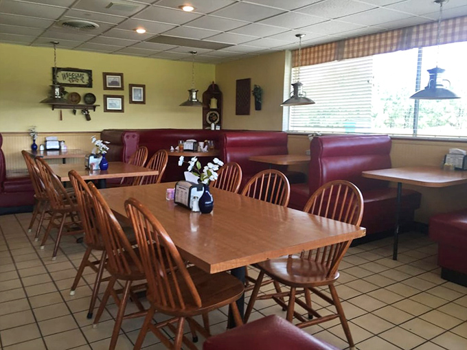 The dining room at Blake's—where Windsor chairs meet burgundy booths, and strangers become regulars before the first cup of coffee is empty.