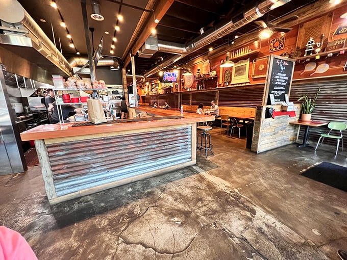 Industrial chic meets Southern comfort in this space where corrugated metal, warm wood, and concrete floors create the perfect backdrop for poultry perfection.