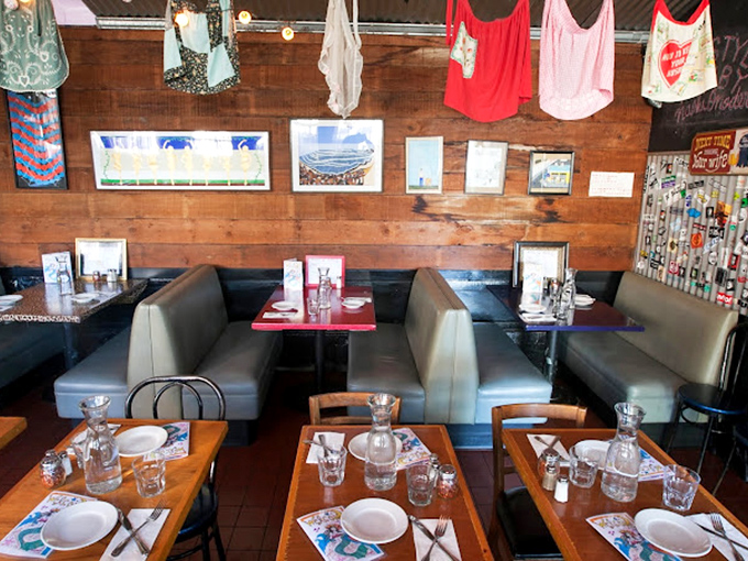 These rustic booths have welcomed more meaningful conversations and pasta-induced happiness than most therapists' couches in the city.