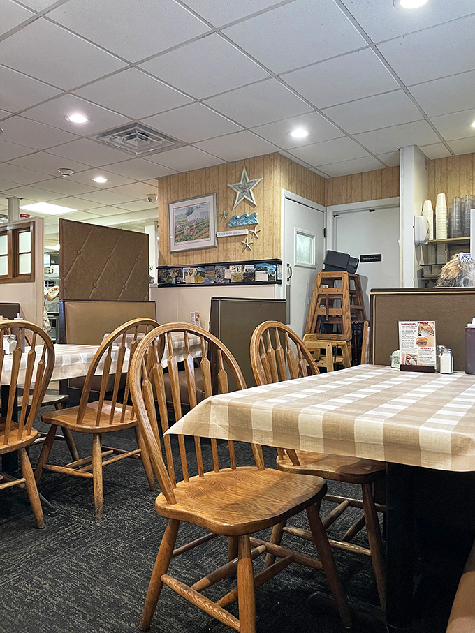Simple wooden chairs, checkered tablecloths, and wood-paneled walls create the perfect backdrop for food that speaks volumes without needing fancy surroundings.