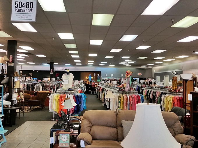 Stepping inside reveals a meticulously organized wonderland where furniture mingles with clothing racks in a dance of secondhand luxury that puts big box stores to shame.