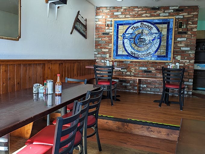 That stained glass welcome sign isn't just decoration&mdash;it's a promise of the warm hospitality and hearty meals waiting inside these brick walls.