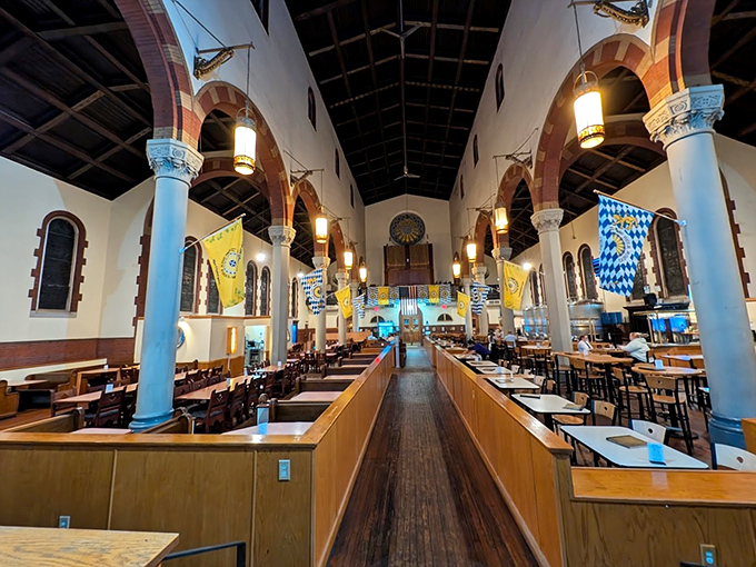 Where pews once held the faithful, tables now welcome hungry pilgrims. The nave's transformation preserves sacred grandeur while serving heavenly brews.
