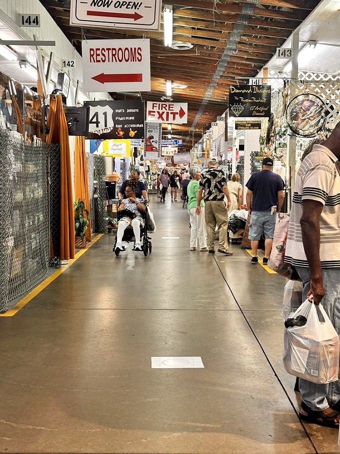 Where shopping becomes an adventure: wide aisles, numbered stalls, and the constant hum of haggling create the symphony of a perfect flea market day.