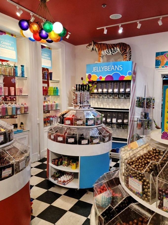 Colorful jellybeans await your selection beneath a whimsical balloon chandelier, while a tiger watches over the candy kingdom.