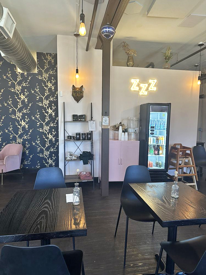 Modern minimalism with soul. The ZZZ neon sign winks at the irony of a place dedicated to waking you up beautifully.