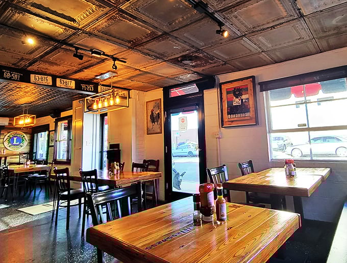 Vintage tin ceilings, license plates, and warm wooden tables create that rare atmosphere that's both Instagram-worthy and genuinely comfortable.