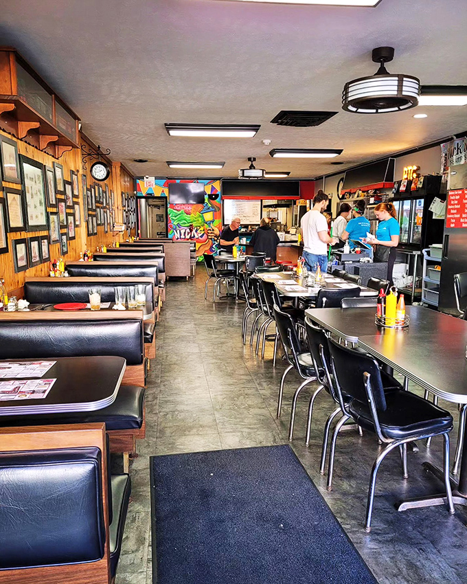 Inside Nick's Kitchen, classic diner aesthetics meet small-town charm with wood-paneled walls covered in local memories and history.