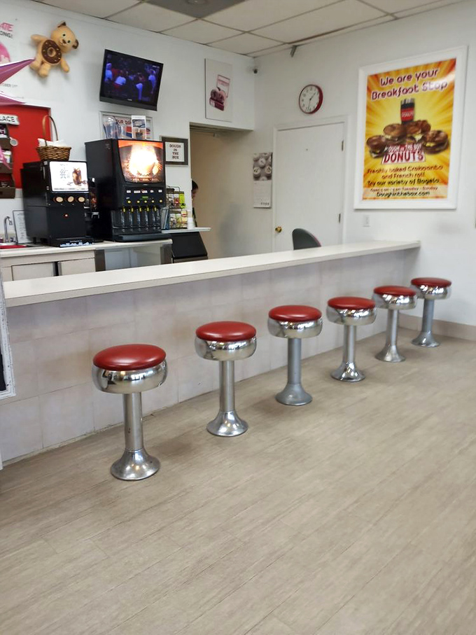 Classic diner-style counter seating invites you to slow down and savor the moment. Those red stools have witnessed countless sugar-induced smiles over the years.