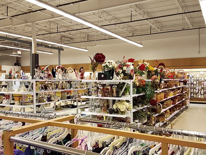 A thrifter's paradise unfolds inside with meticulously organized shelves of home decor. That floral arrangement might have graced someone's wedding table last month!
