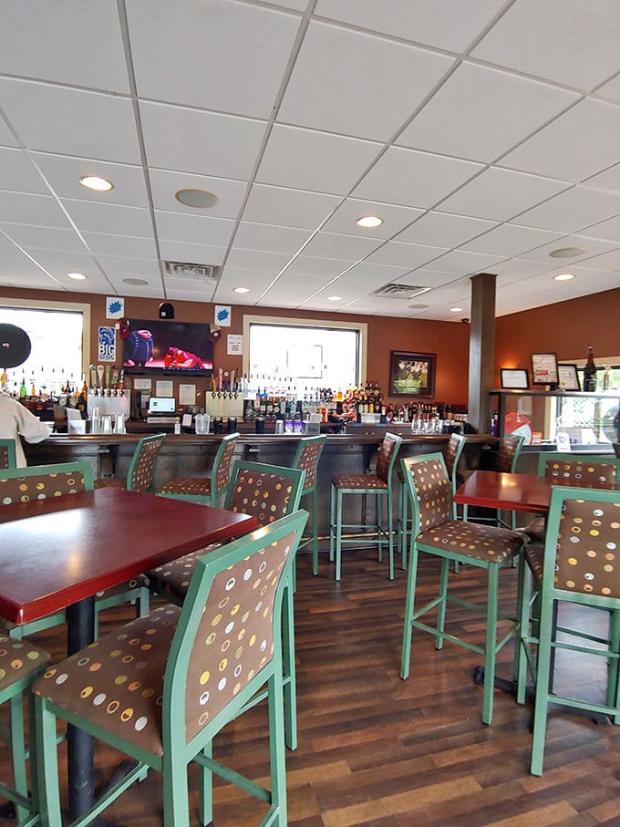 The bar area strikes that perfect balance between "treat yourself" and "make yourself at home." Those distinctive green chairs have witnessed countless toasts and first dates.