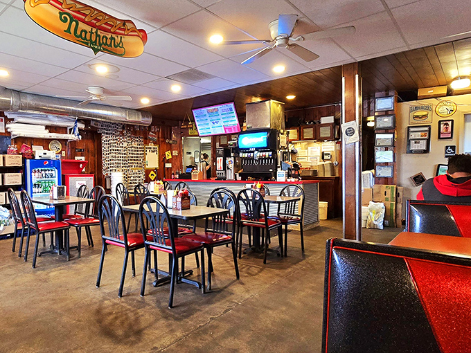 Step inside and time seems to stand still. Wood paneling, Nathan's memorabilia, and red vinyl seats create the burger joint atmosphere dreams are made of.
