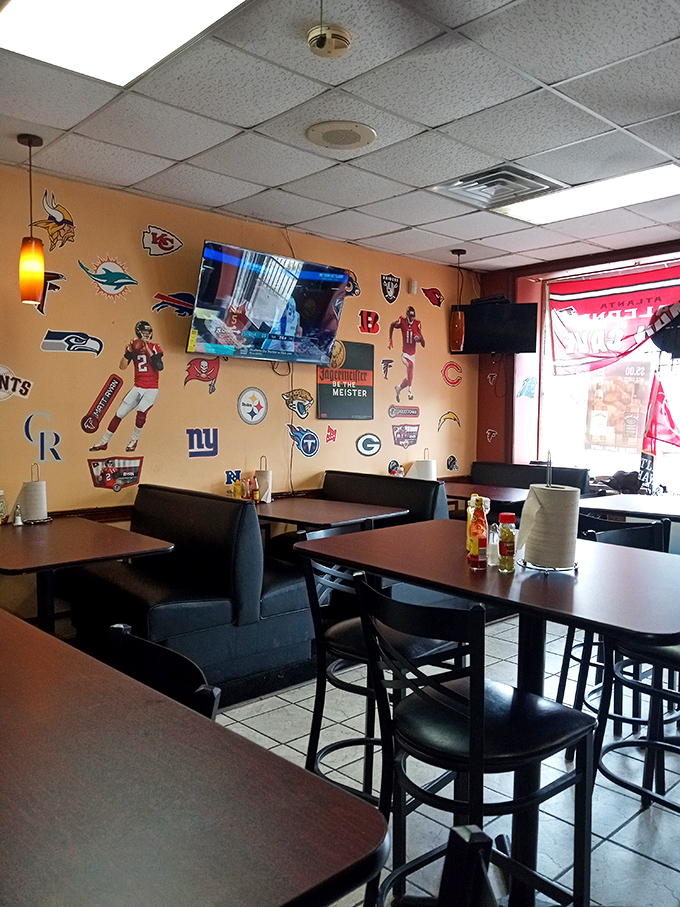 Sports memorabilia covers every inch of wall space, creating the perfect backdrop for meat-induced happiness. No interior designer needed when the food's this good.