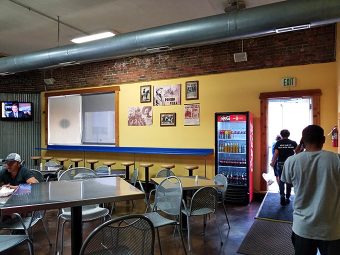 Yellow walls, exposed brick, and simple metal chairs&mdash;this no-nonsense dining room lets you focus on what matters: the impending food coma you'll happily embrace.