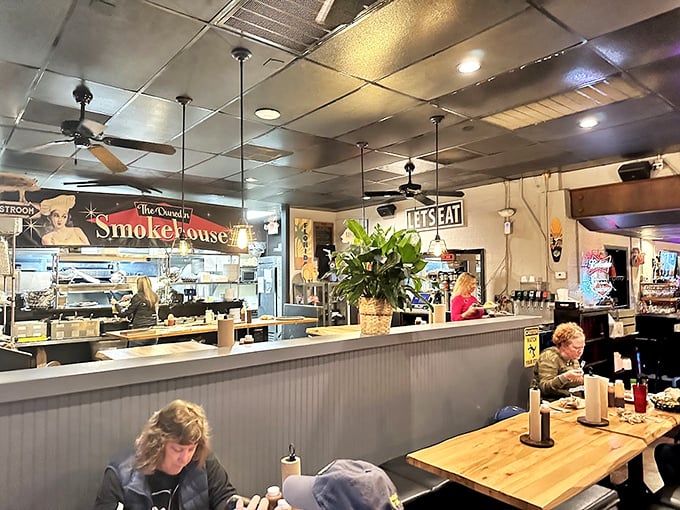 Inside, the open kitchen concept lets you witness the magic happening. It's like barbecue theater, with you in the front row.